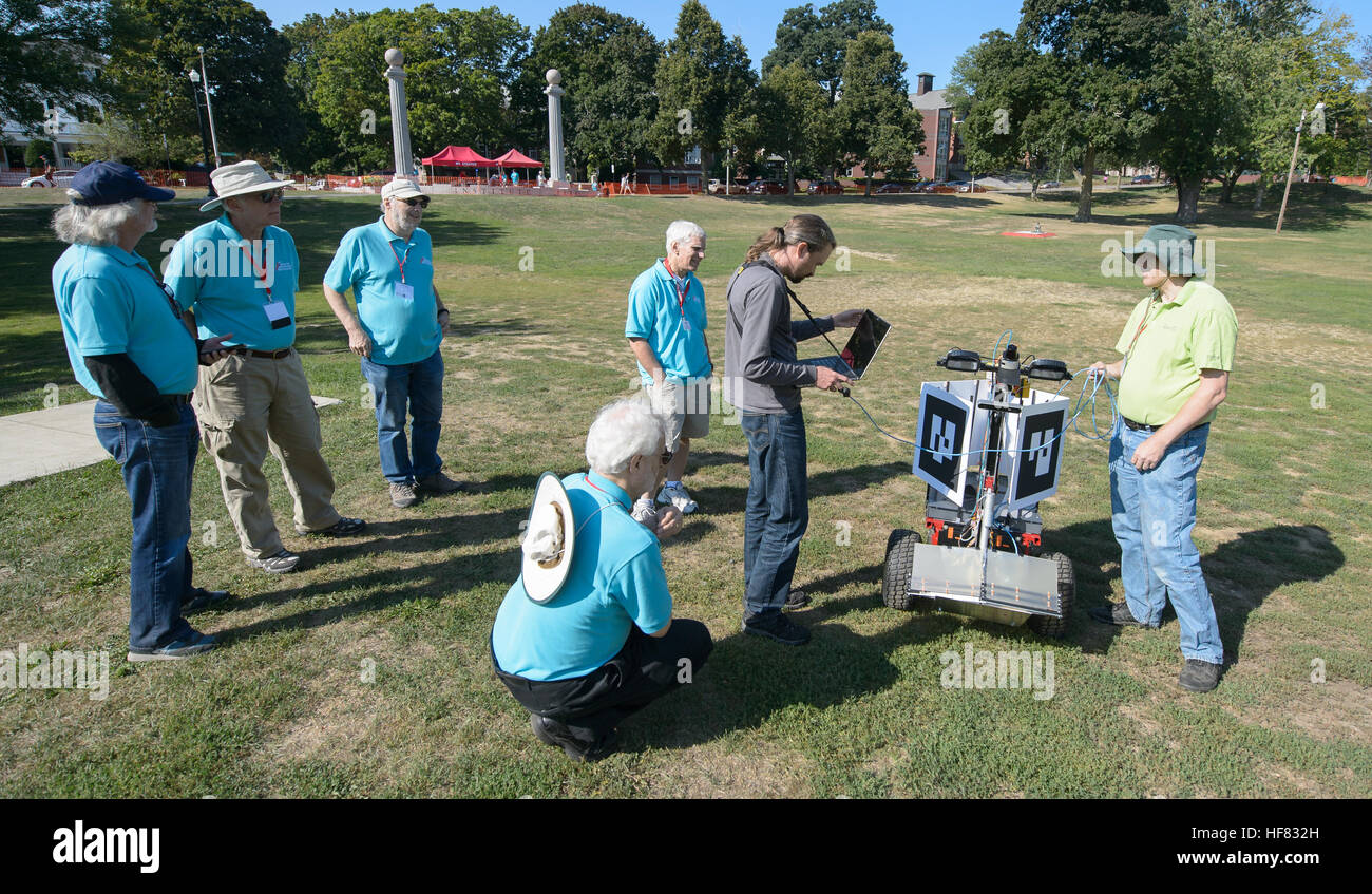 Members of the MAXed Out team are seen working on their robot during a ...