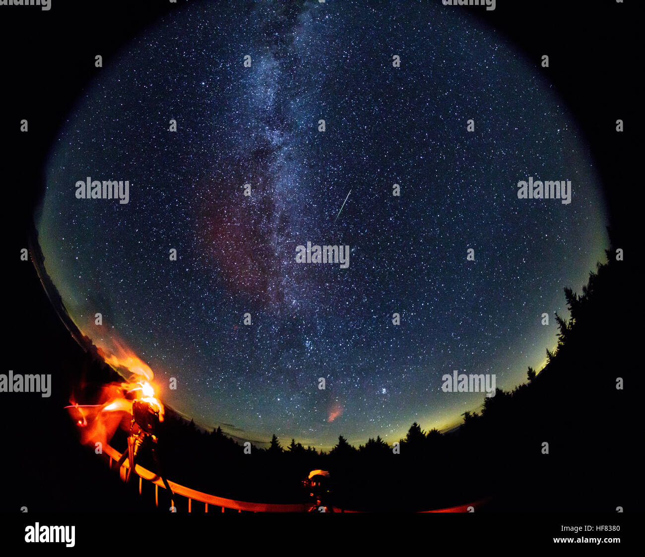A meteor streaks across the sky during the Perseid meteor shower ...