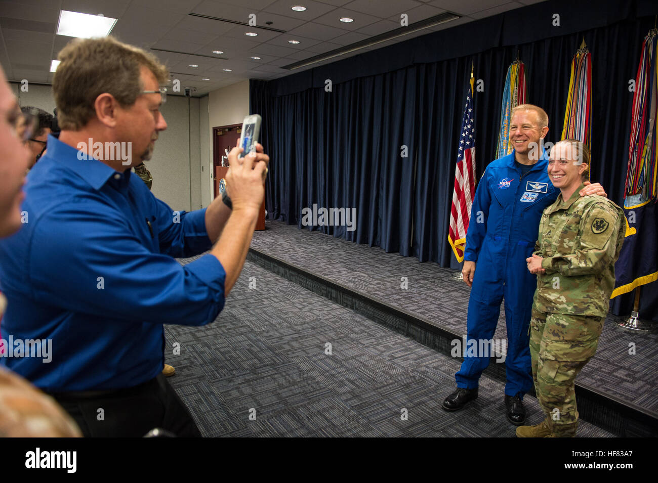 NASA astronaut Tim Kopra poses for a photo with a student after giving ...