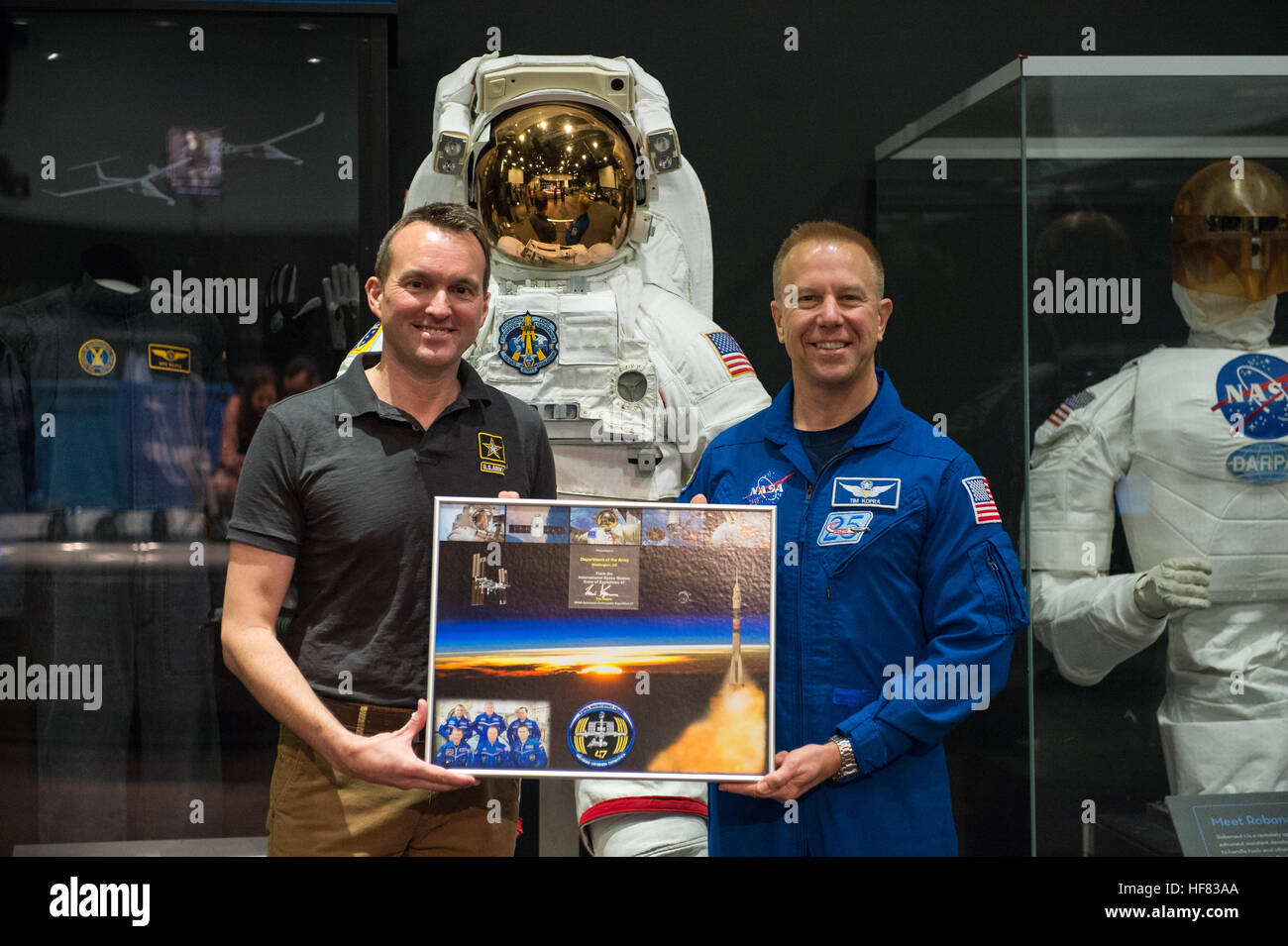 NASA astronaut Tim Kopra presented Secretary of the Army Eric Fanning ...