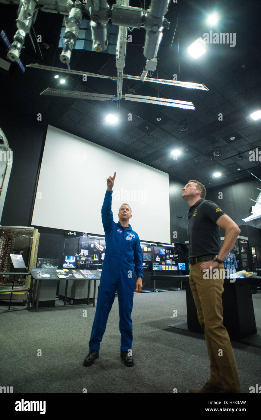 NASA astronaut Tim Kopra, left, speaks with Secretary of the Army, Eric ...
