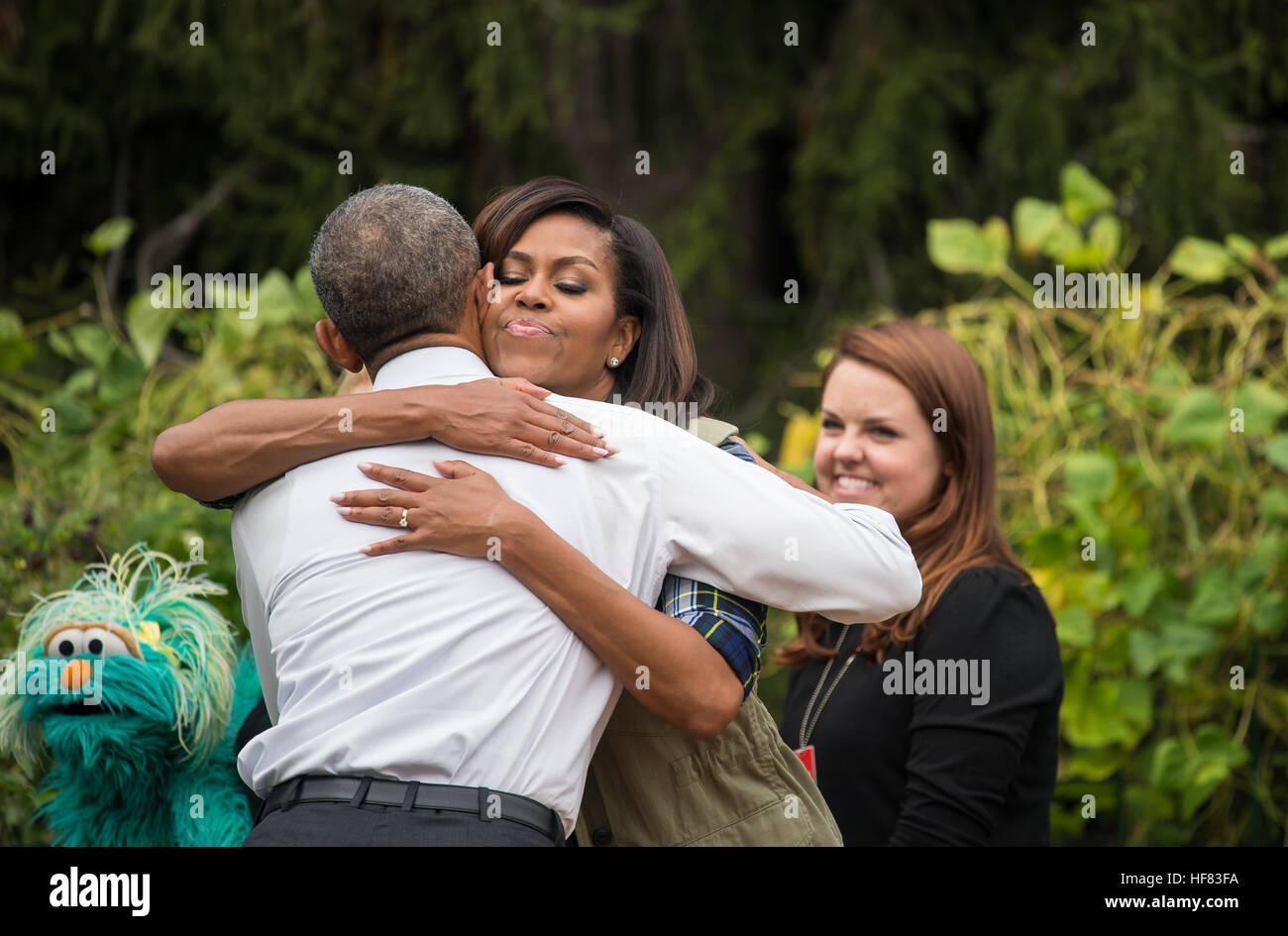 President Barack Obama gives First Lady Michelle Obama a hug at the ...