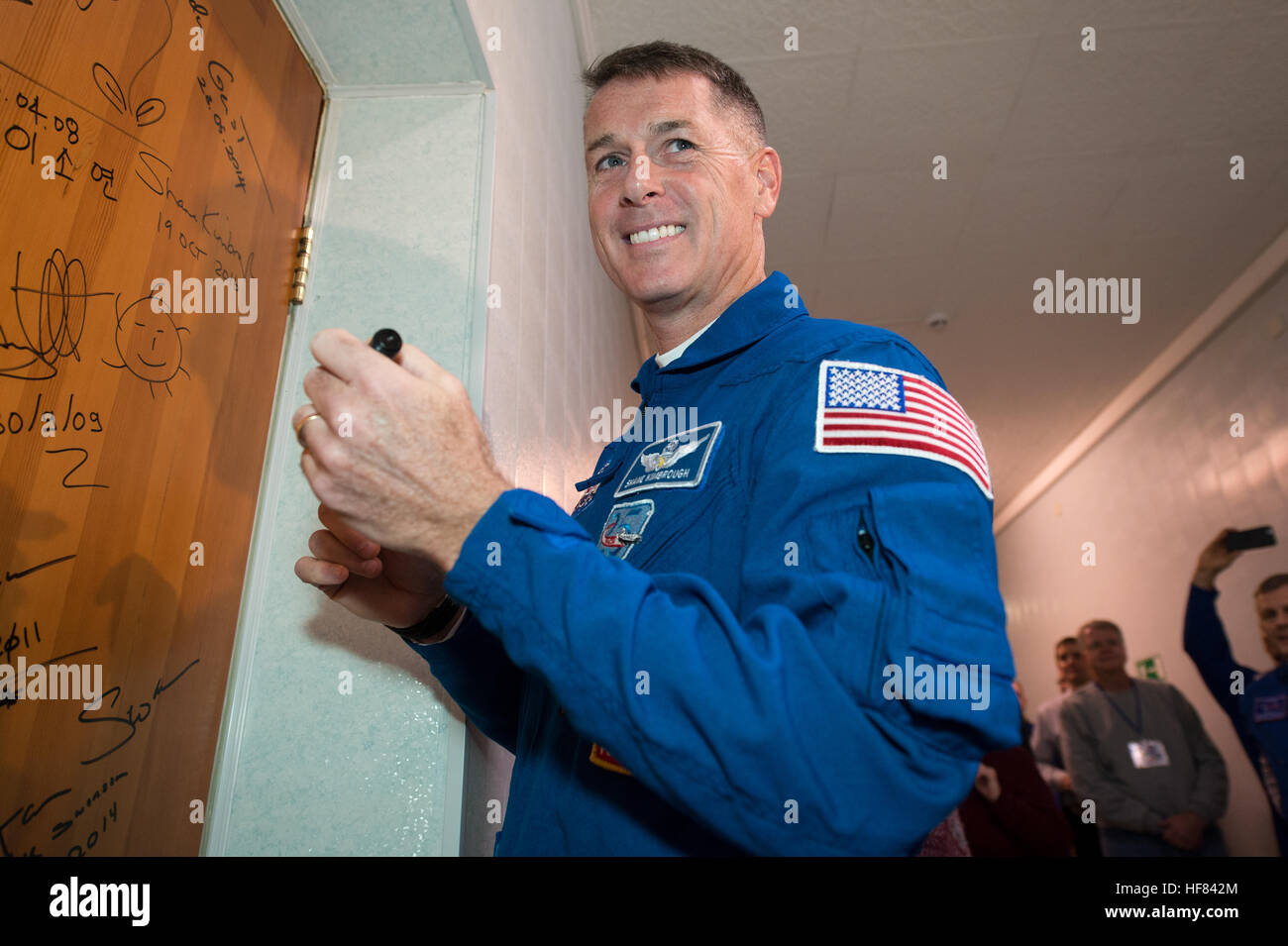 Expedition 49 flight engineer Shane Kimbrough of NASA performs the ...