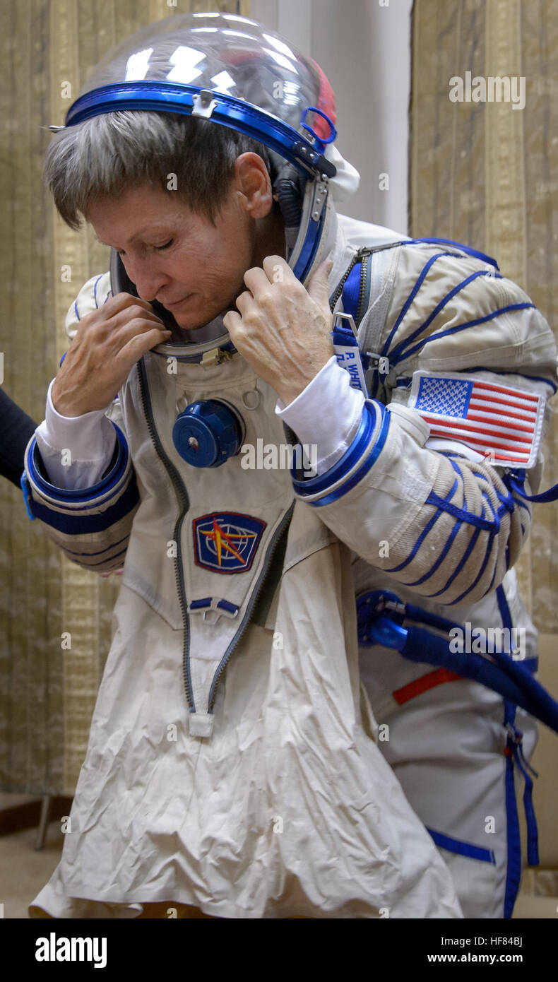 Expedition 50 NASA astronaut Peggy Whitson dons her Sokol suit ahead of ...