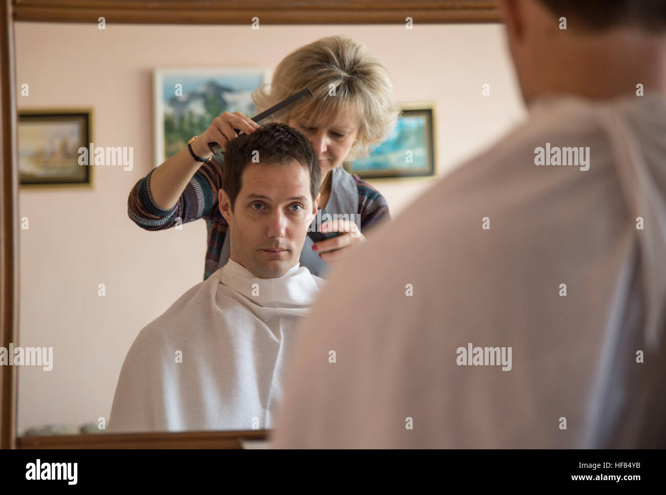 ESA astronaut Thomas Pesquet receives a pre-launch haircut at the ...
