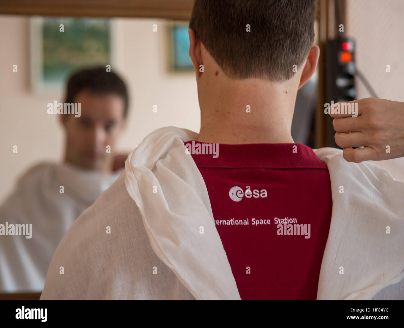 ESA astronaut Thomas Pesquet receives a haircut at the Cosmonaut Hotel ...