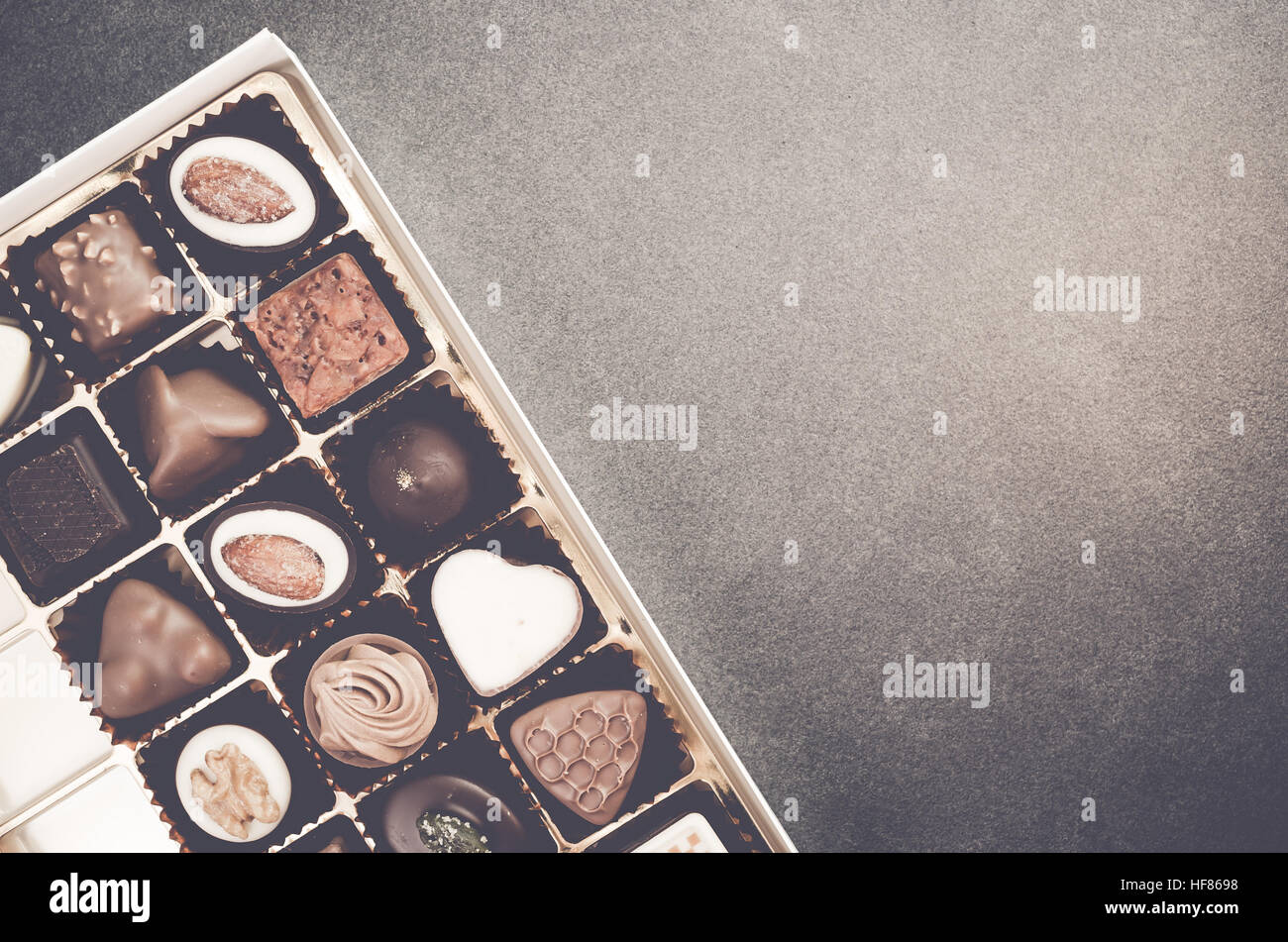 fine chocolates box top view - dark slate worktop Stock Photo - Alamy