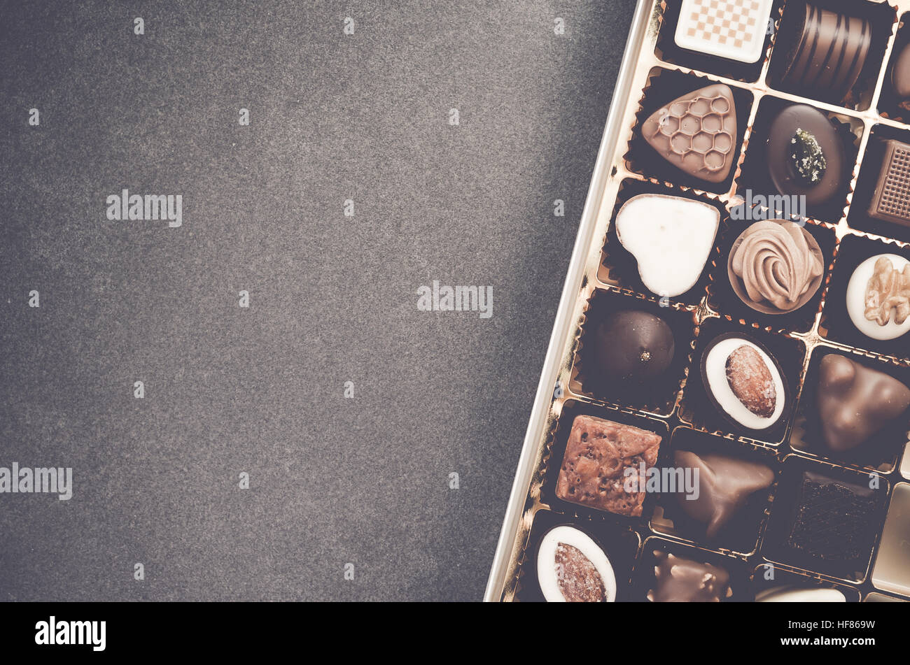 fine chocolates box top view - dark slate worktop Stock Photo - Alamy