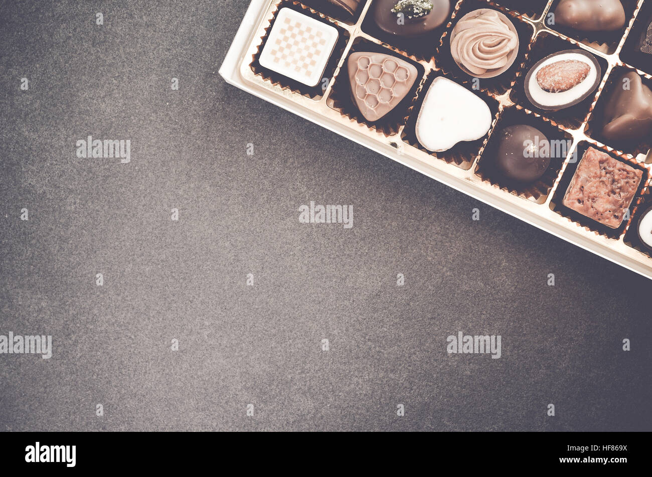 fine chocolates box top view - dark slate worktop Stock Photo - Alamy