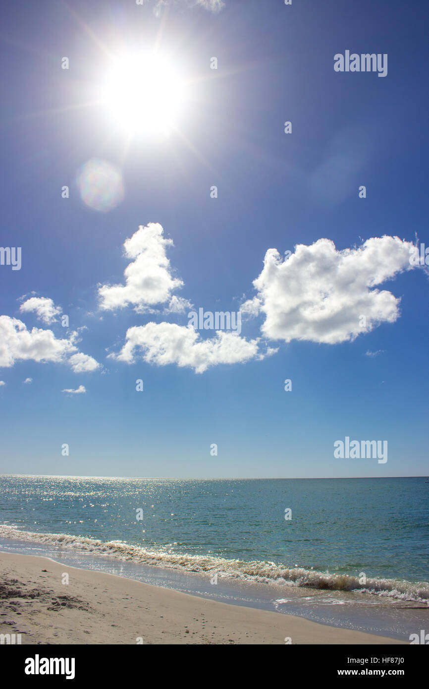 High Sun at the Beach Stock Photo - Alamy