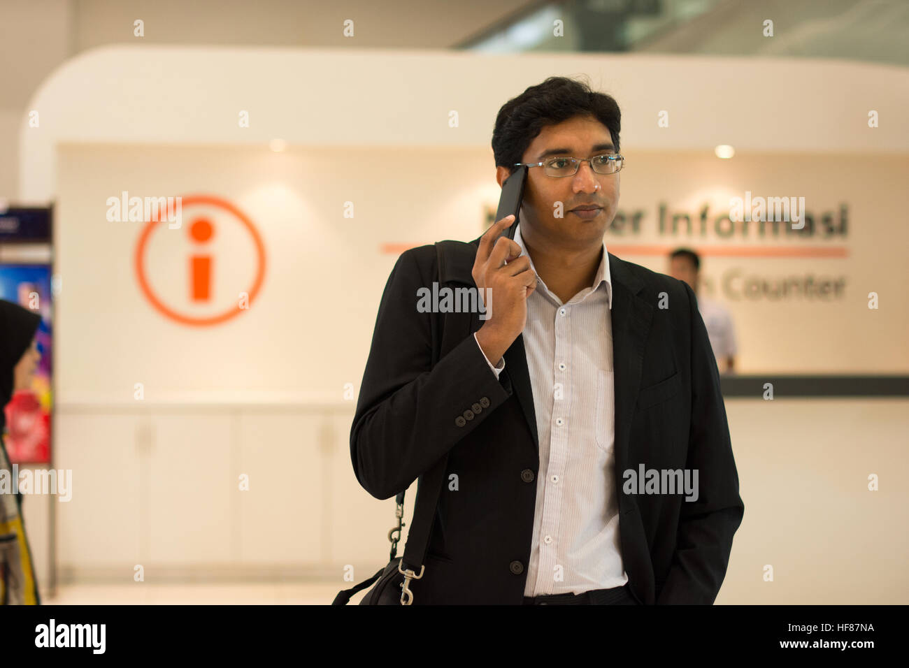 indian business male information counter Stock Photo - Alamy