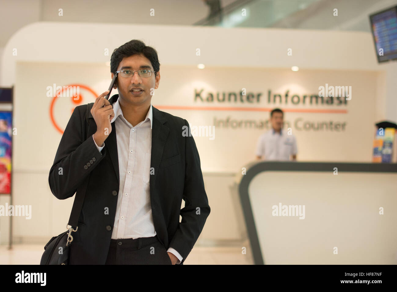 indian business male information counter Stock Photo - Alamy