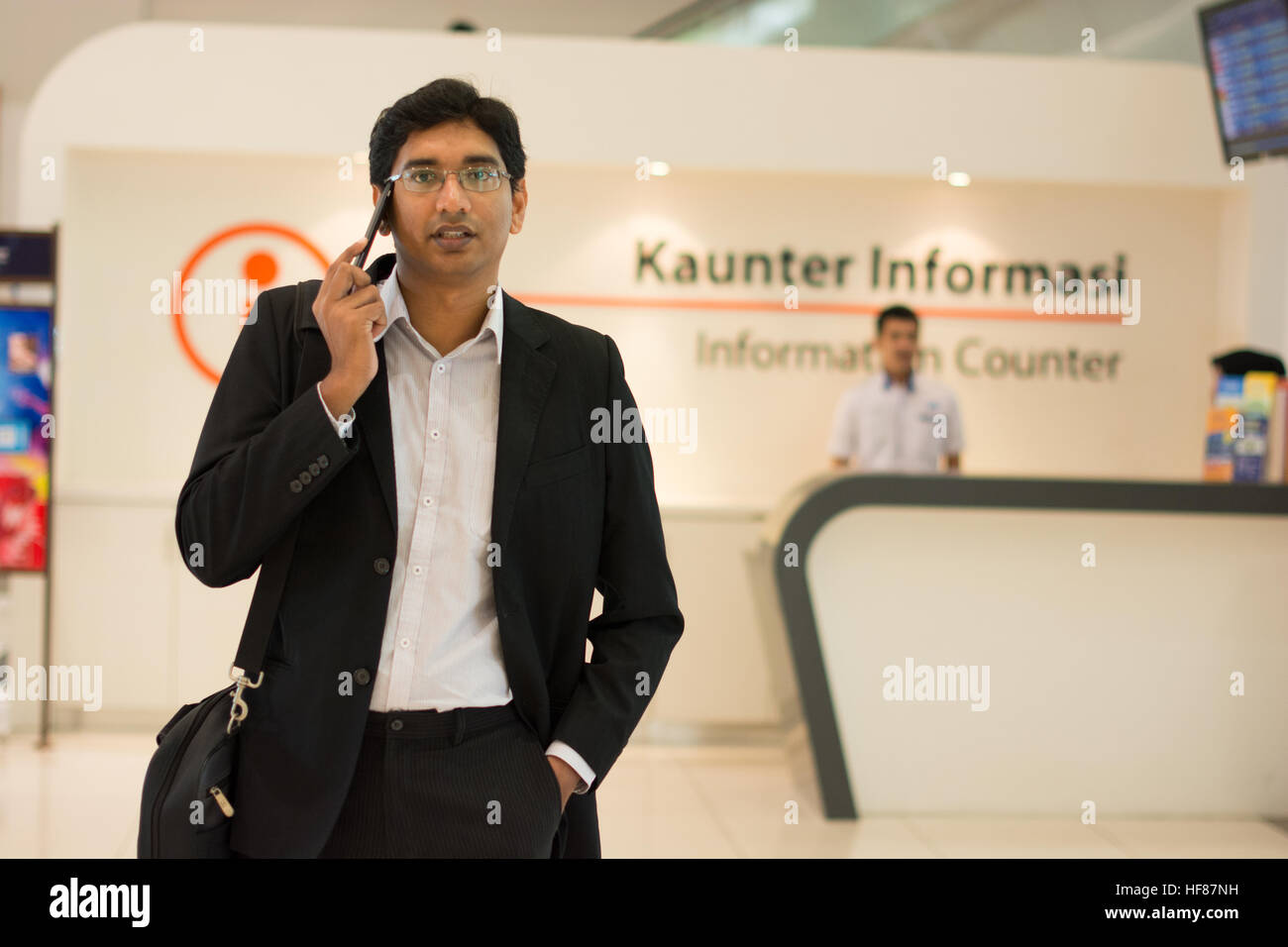 indian business male information counter Stock Photo - Alamy