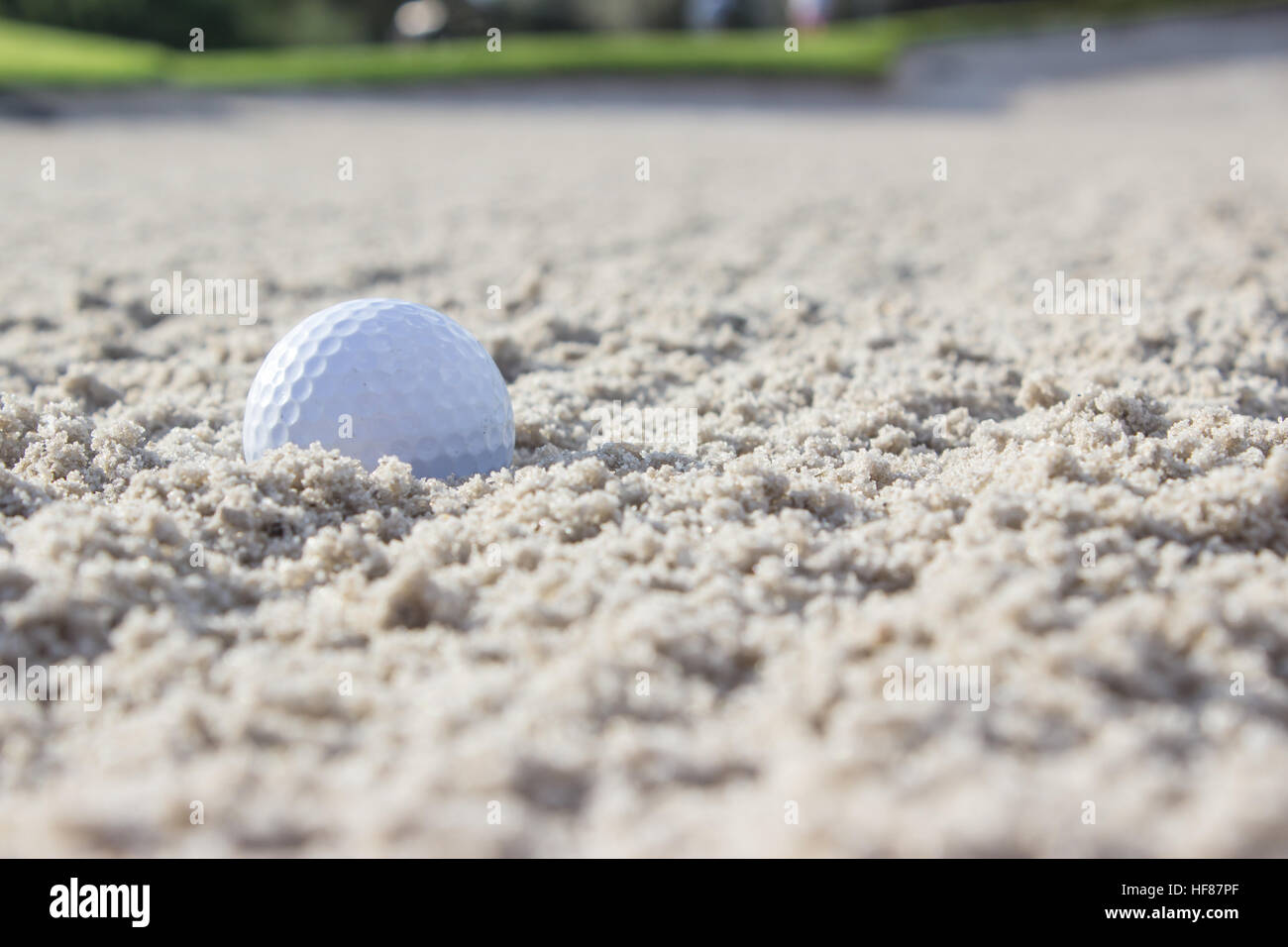 Golf Ball in Sand Trap Stock Photo - Alamy