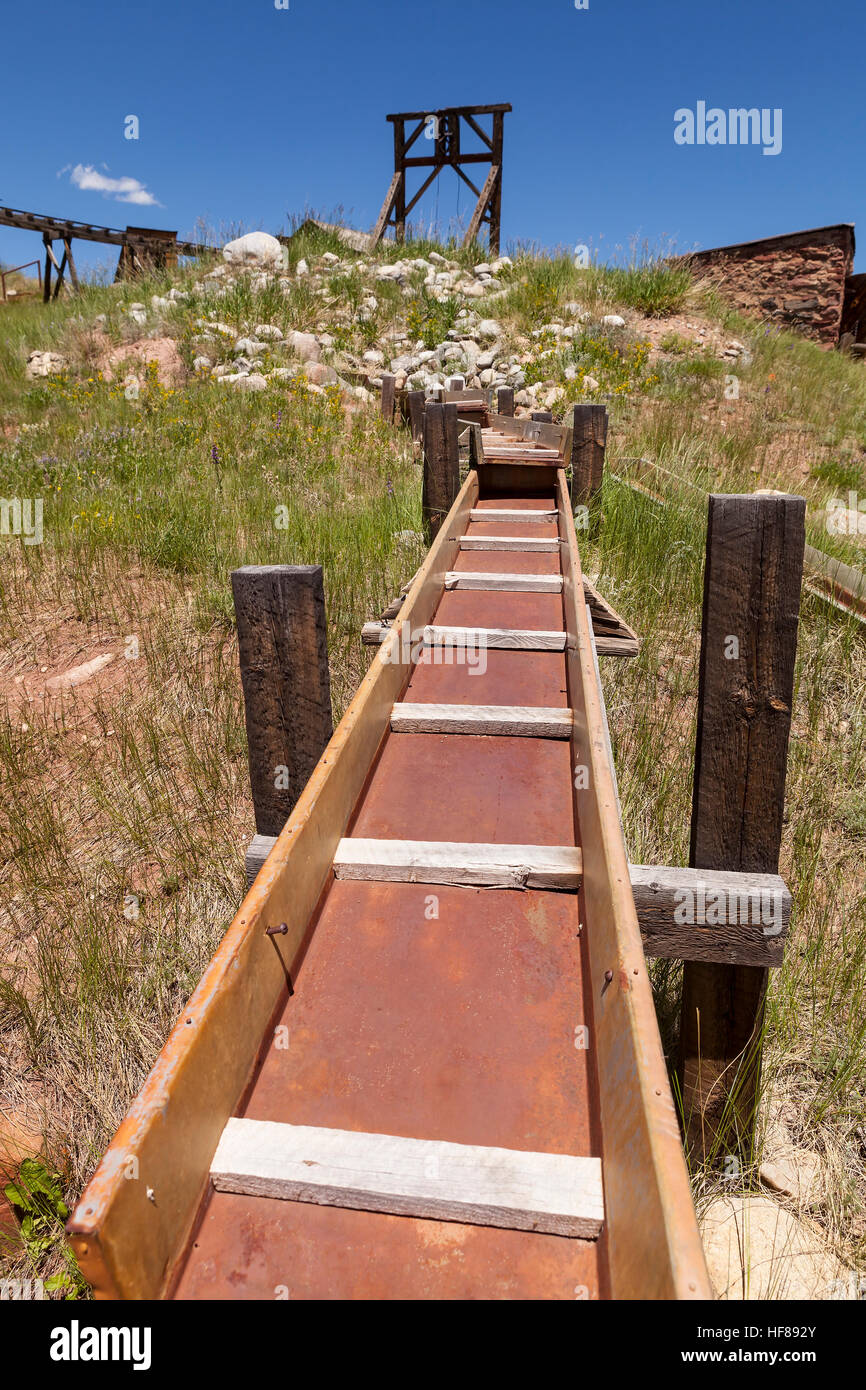 Old gold mining sluice and head frame Stock Photo - Alamy