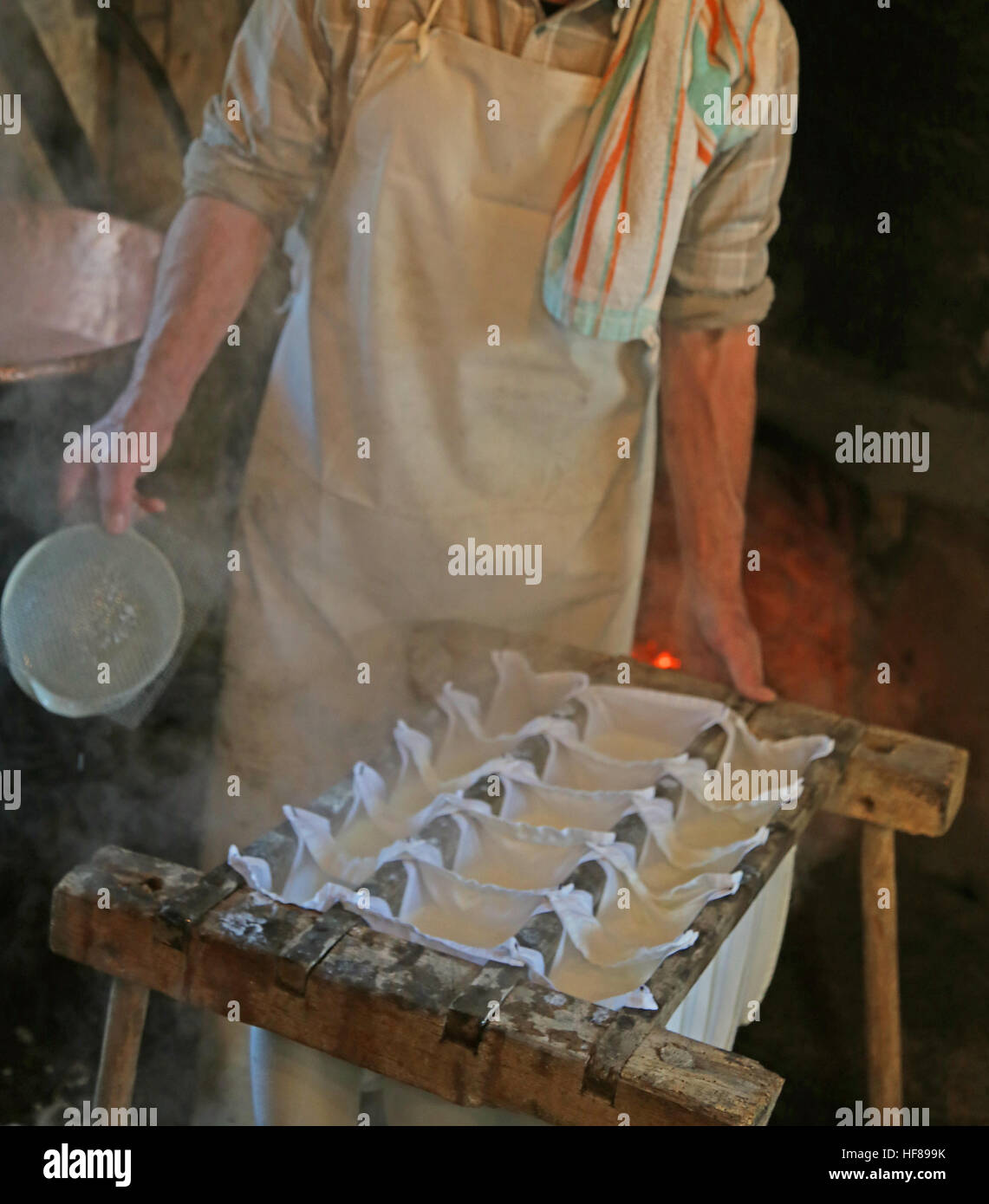 expert cheesemaker during cheese production in a hut Stock Photo - Alamy