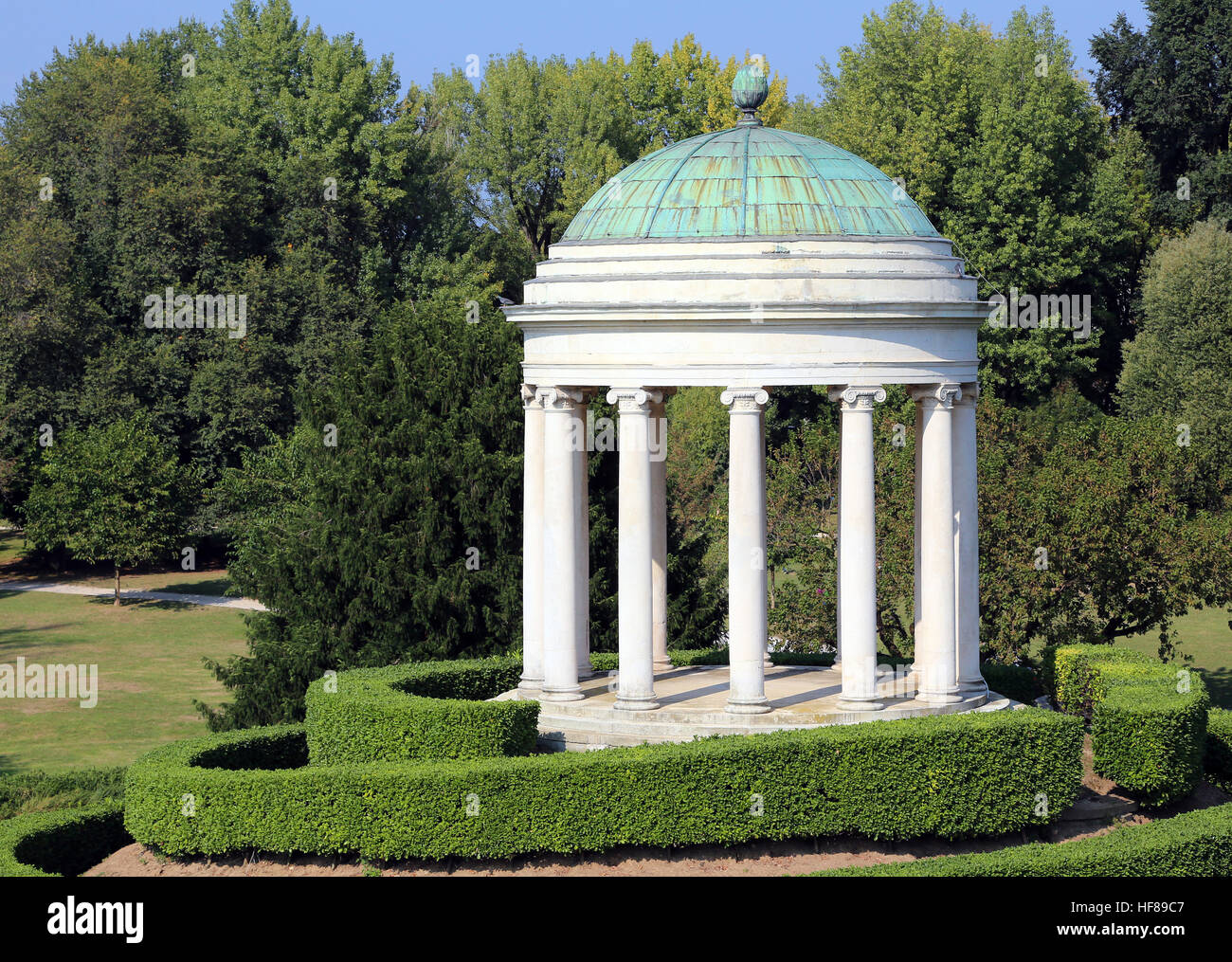 Ancient monopteros with the dome in classic style over the public park ...