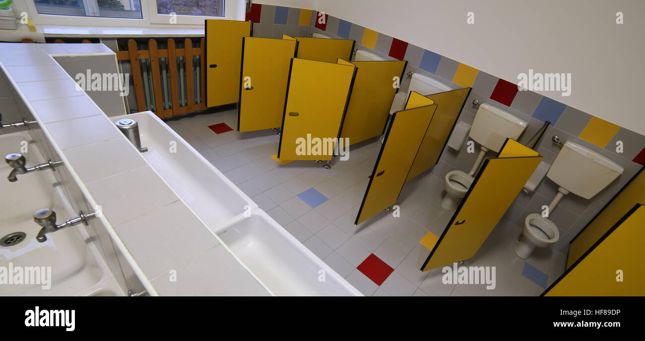 kindergarten children bathroom with small water closet and ceramic ...