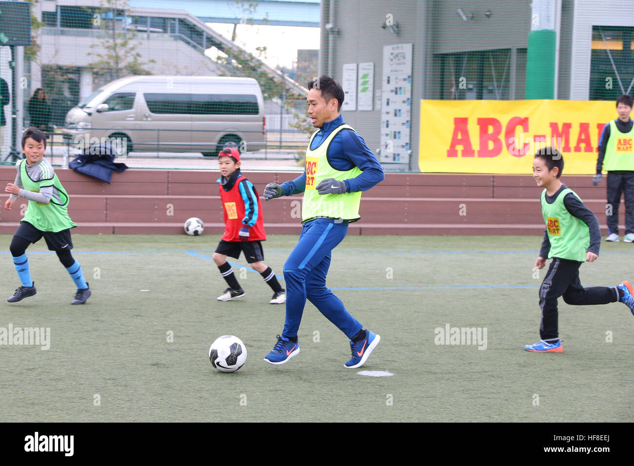 Japanese soccer player Yuto Nagatomo plays soccer with children during ...