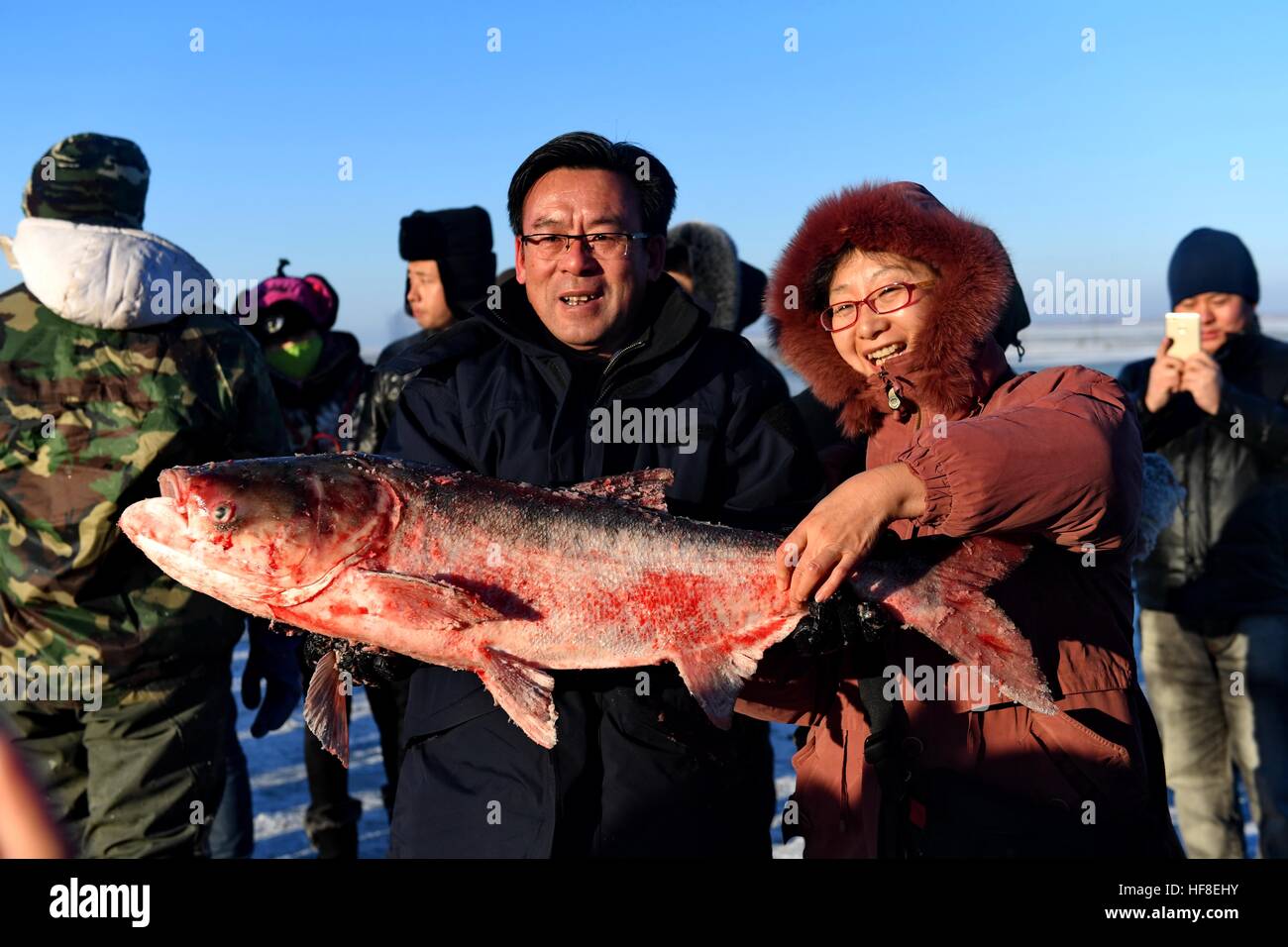 Songyuan, China's Jilin Province. 28th Dec, 2016. Residents hold a big ...