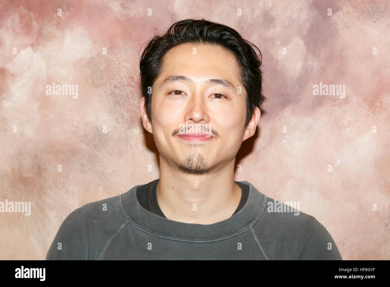 Actor Steven Yeun poses for the cameras during the 11th Hollywood ...