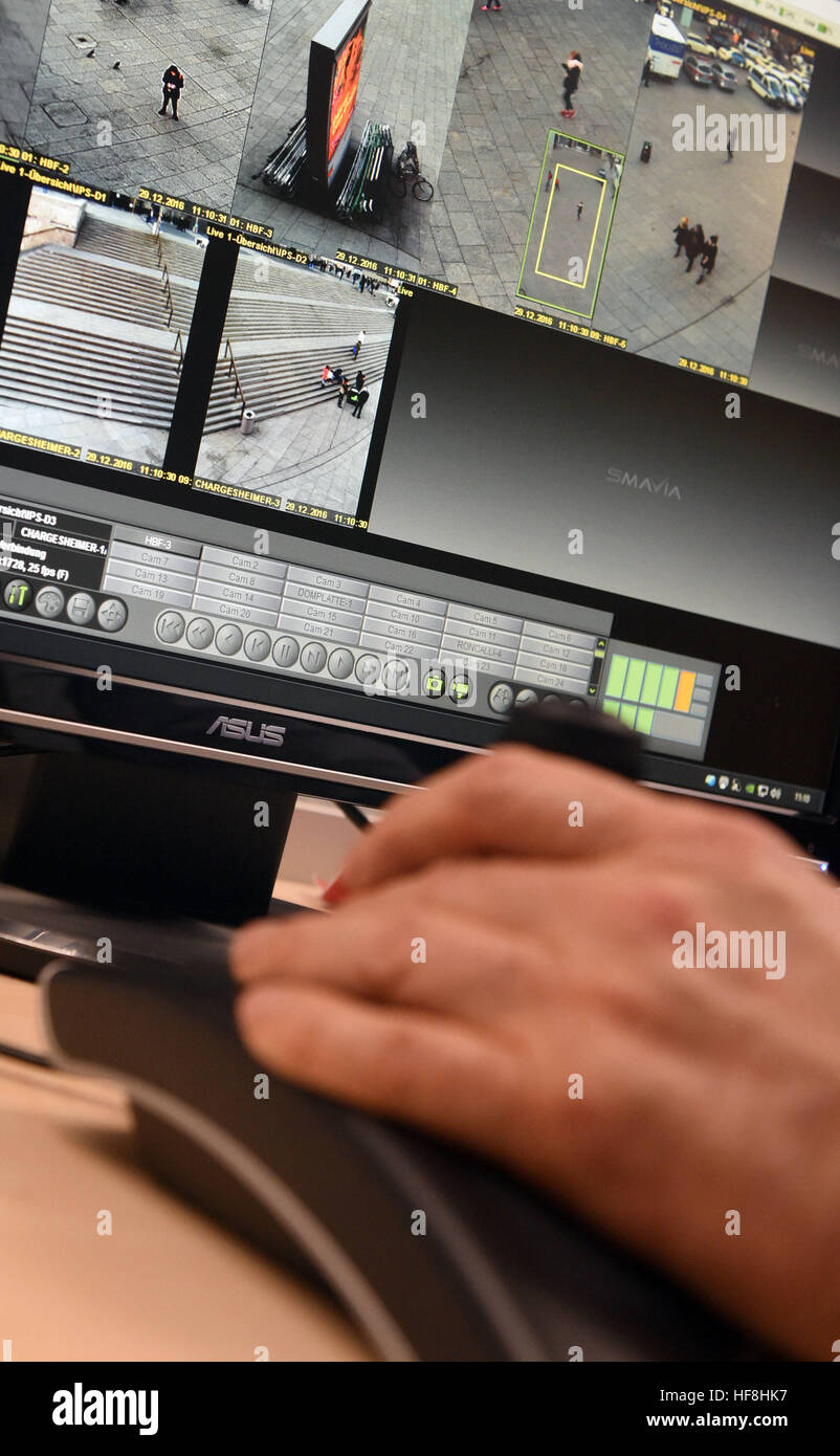 Cologne, Germany. 29th Dec, 2016. A police officer demonstrates a newly ...