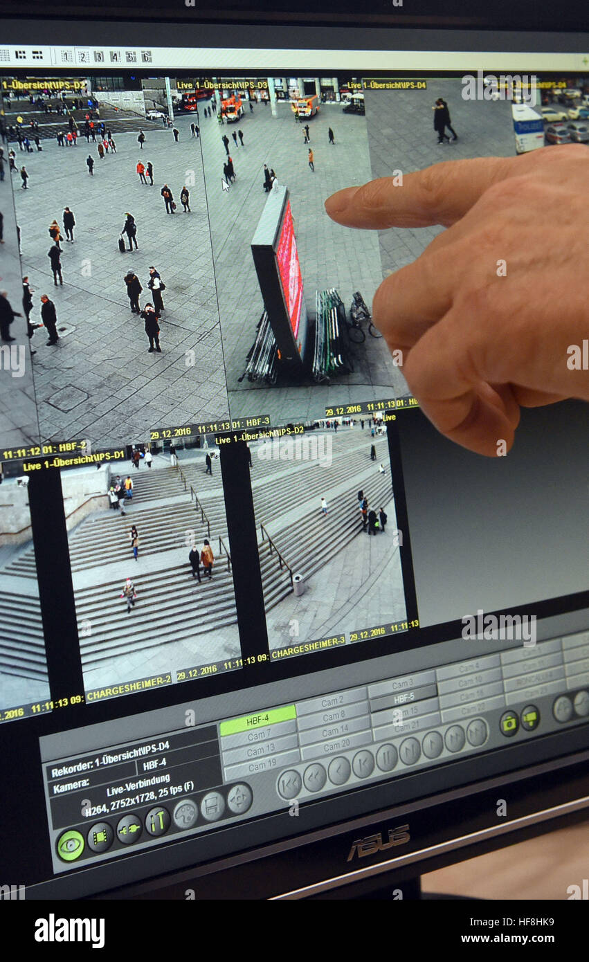 Cologne, Germany. 29th Dec, 2016. A police officer demonstrates a newly ...