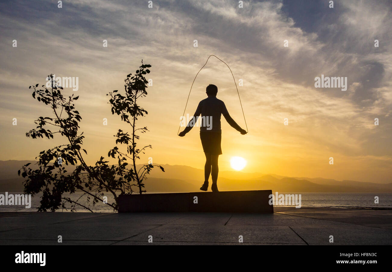 Man Skipping Silhouette Stock Photos & Man Skipping Silhouette Stock ...