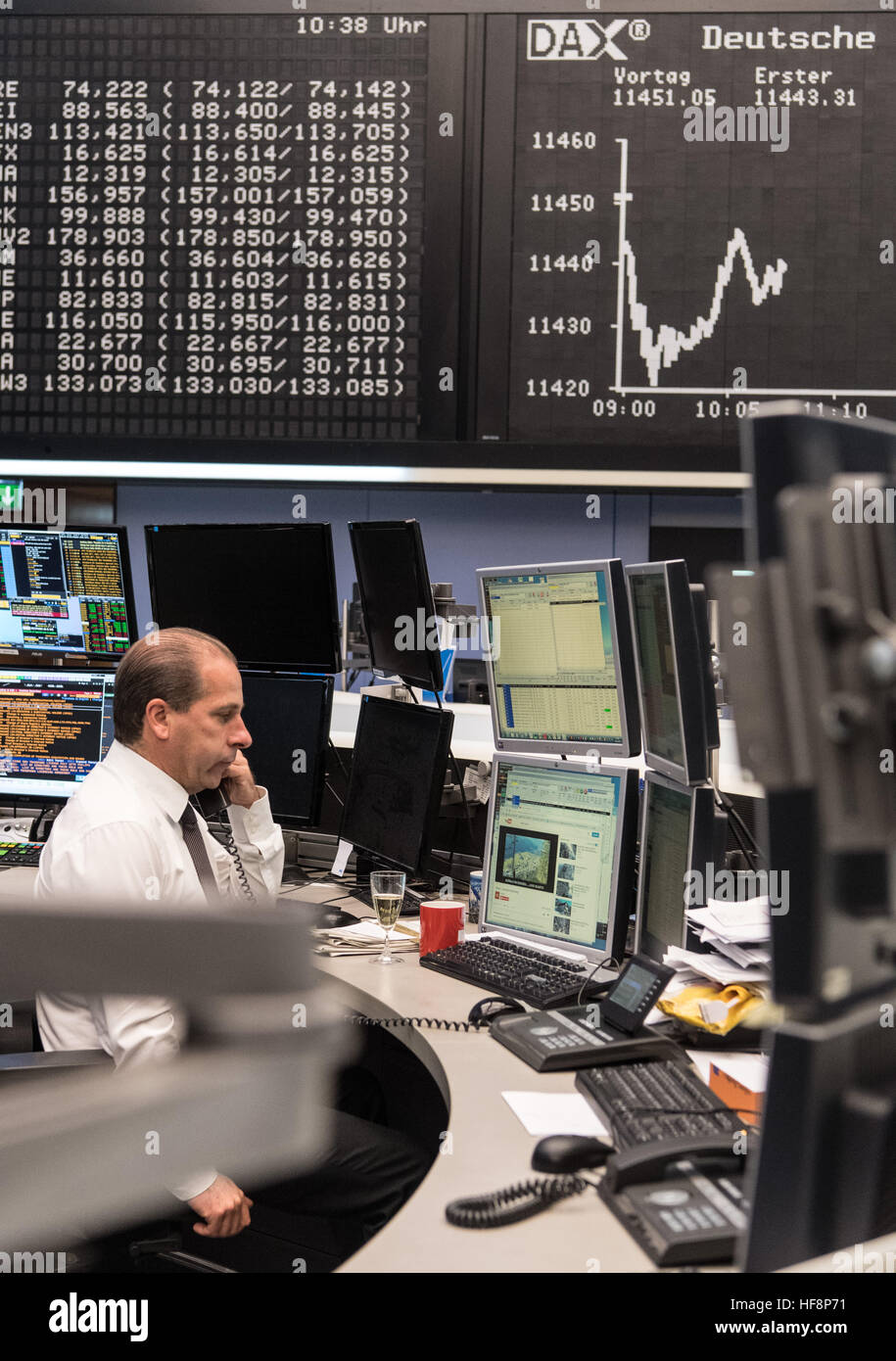 A stockbroker at work in the trading room of the stockmarket in ...