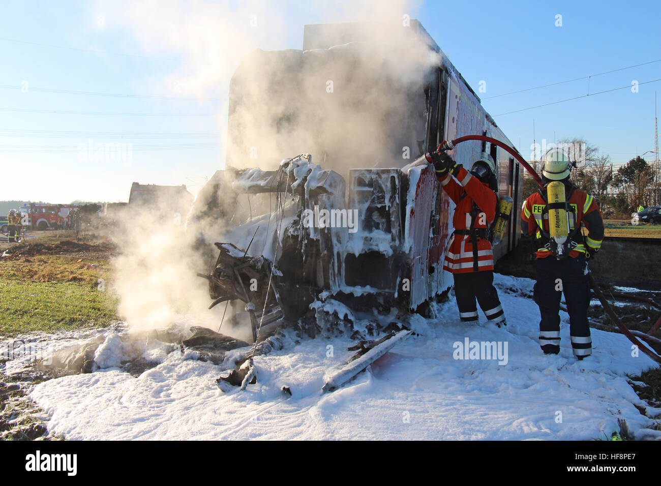 Firemen extinguish a fire burning at the driver's cabin of a regional ...