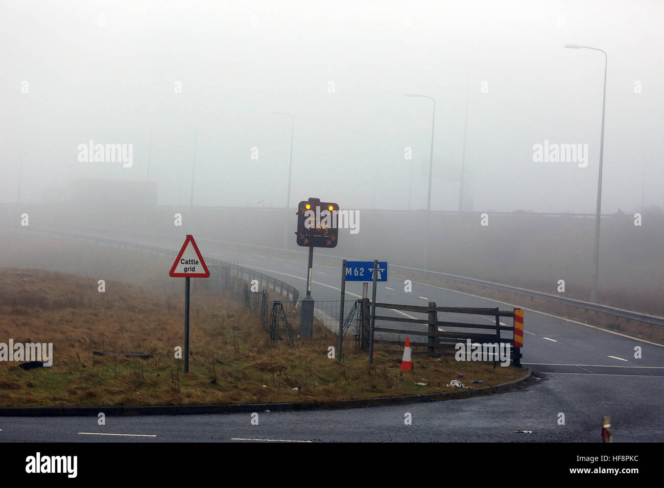 Calderdale, UK. 30th December, 2016. Fog warning lights on M62 junction ...