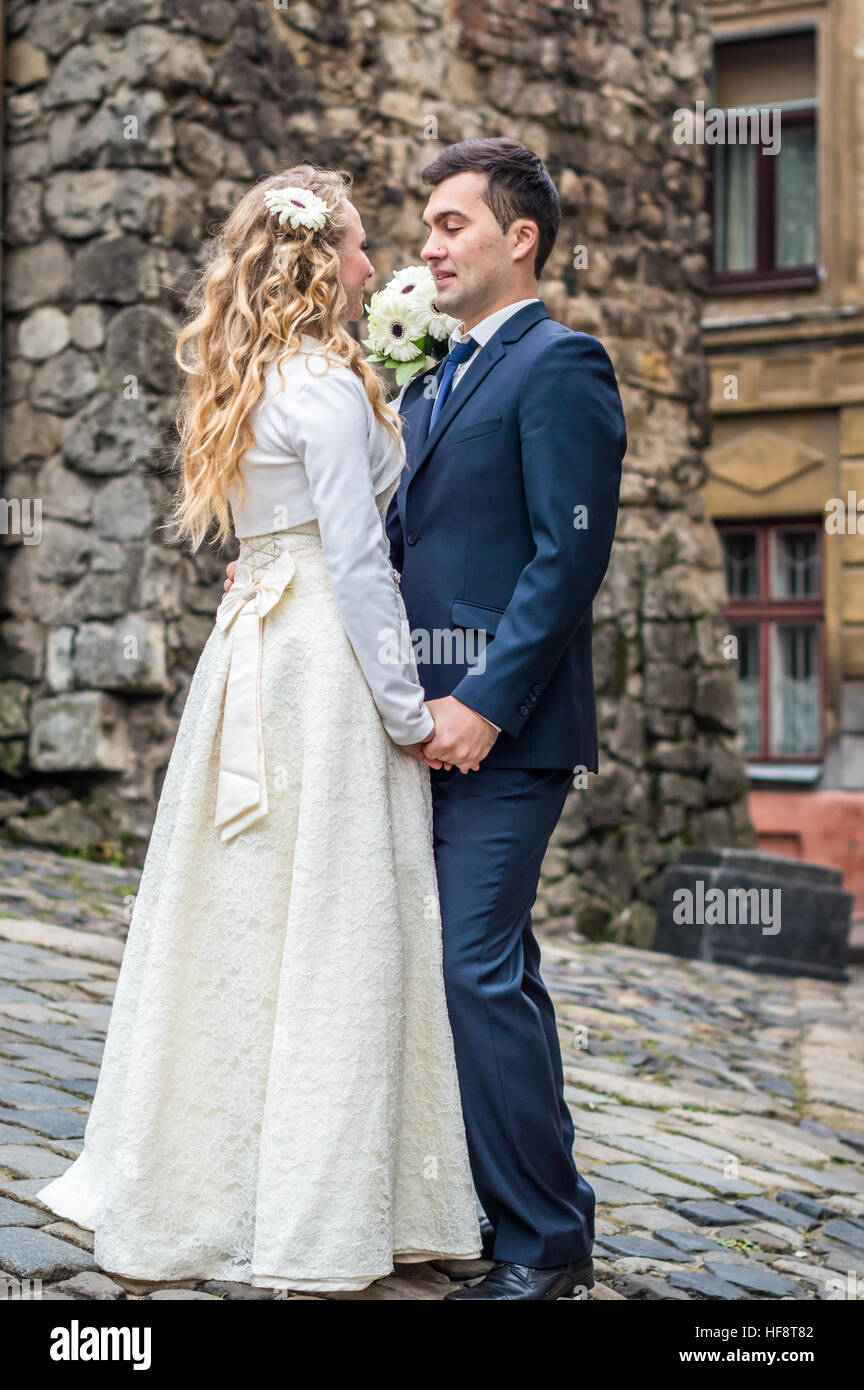 newlyweds strolling around the city Stock Photo - Alamy