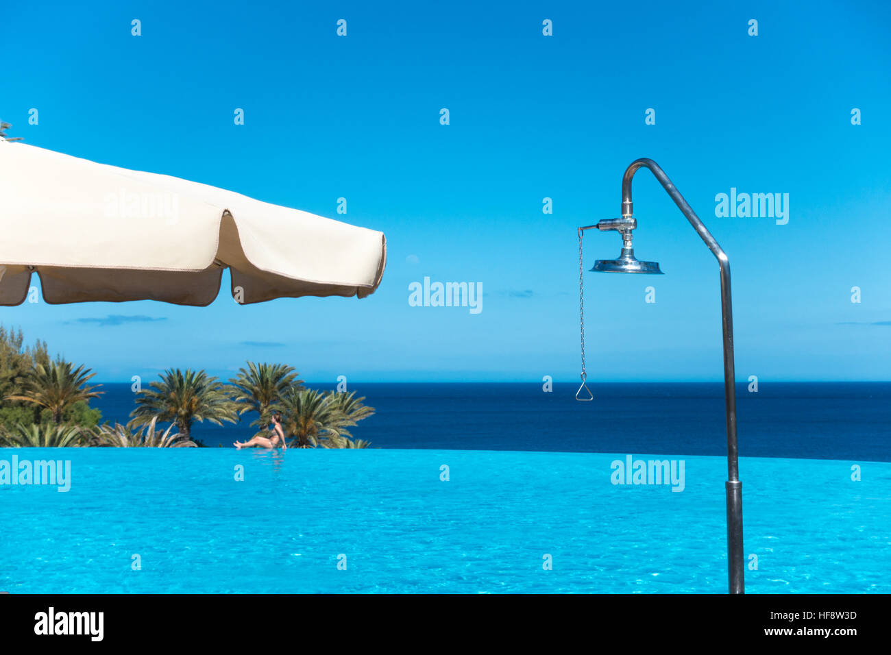 Summer arrangement at the ocean view pool with sunshade and pool shower ...