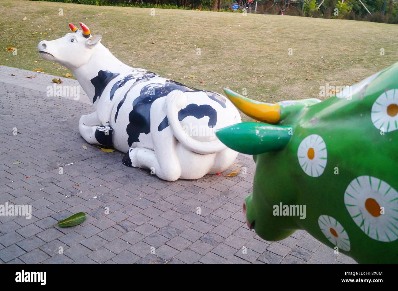 Cow's sculpture landscape, in the park, very beautiful Stock Photo - Alamy