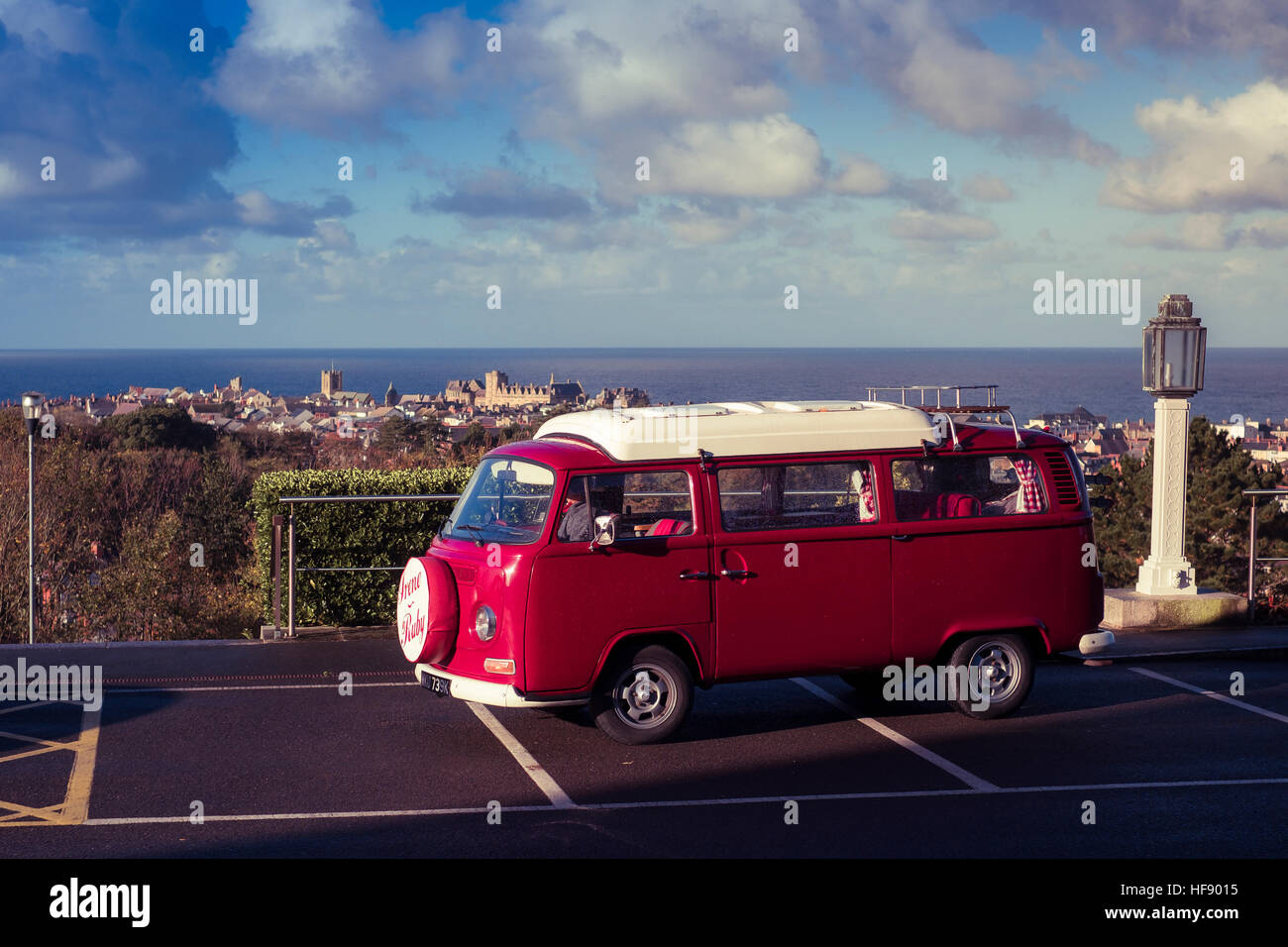 A classic Volkswagen VW Type 2 red campervan parked overlooking the ...