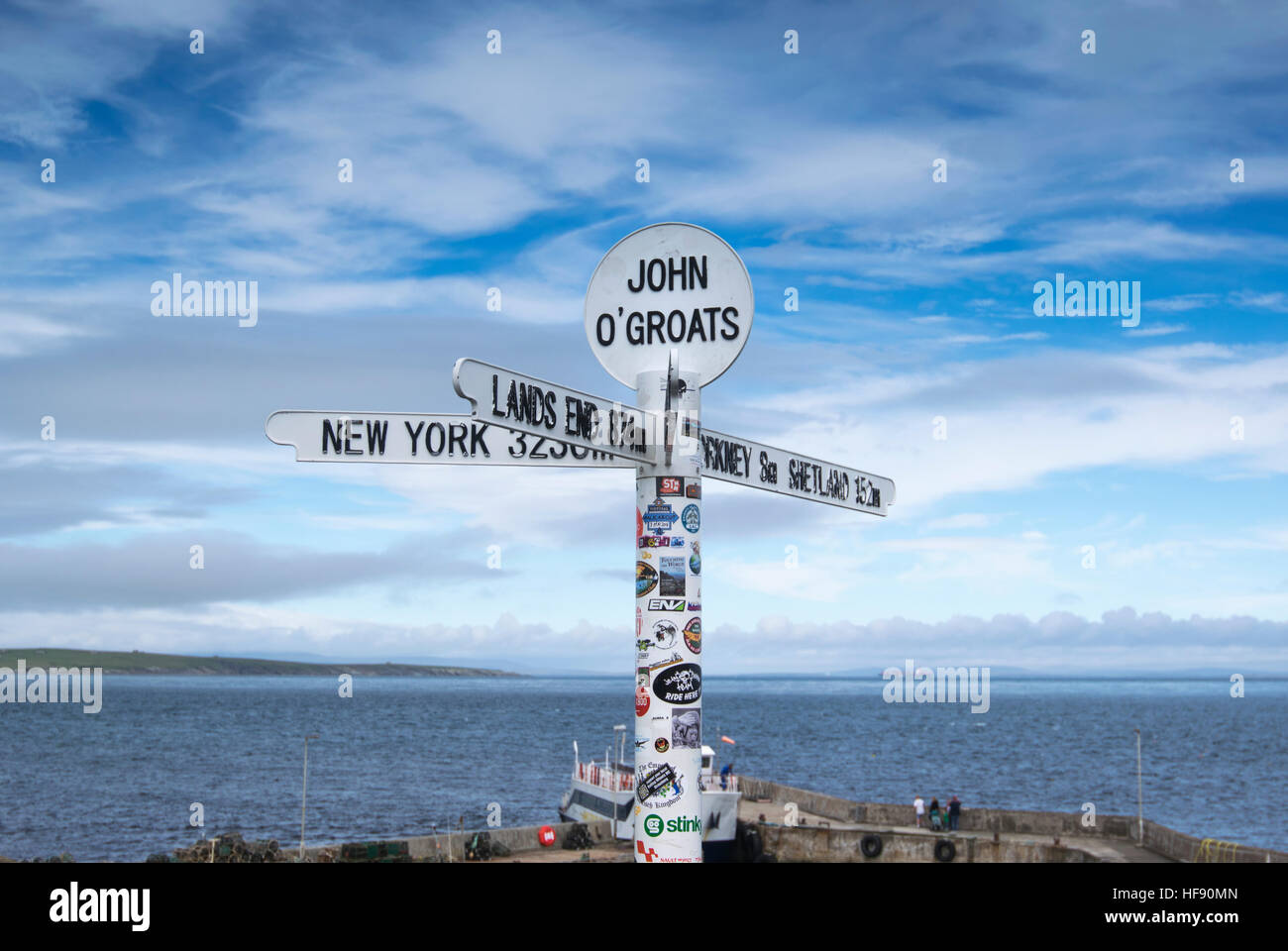 The famous multi-directional signpost at John O'Groats in Scotland ...