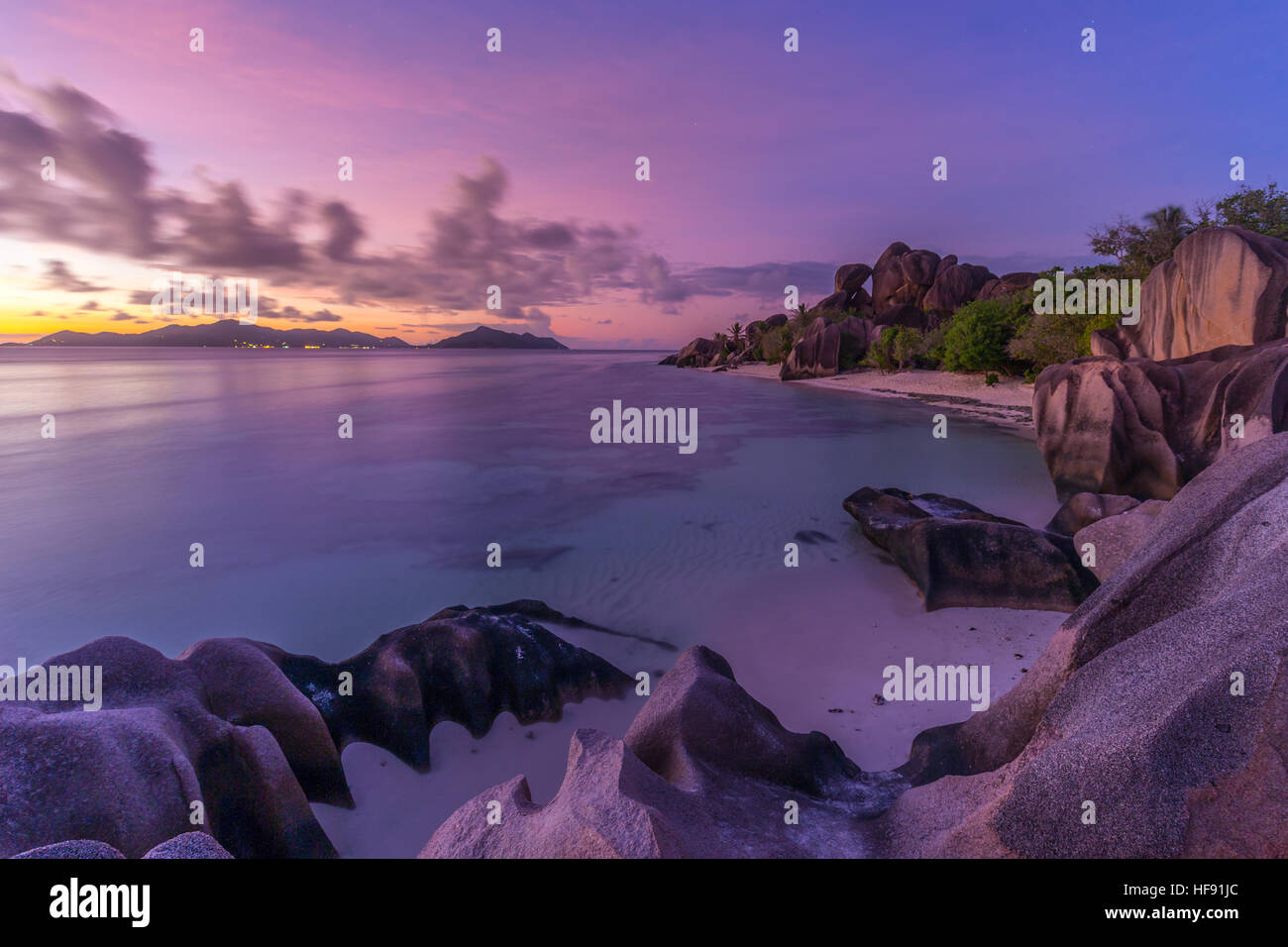 Dramatic sunset at Anse Source d'Argent beach, La Digue island ...