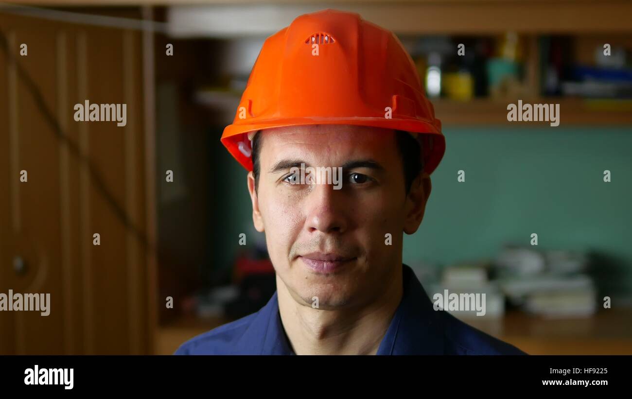 man construction worker in a hard hat indoor portrait Stock Photo - Alamy