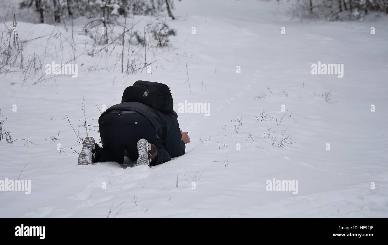 the photographer lies on the snow takes nature landscape winter snow ...