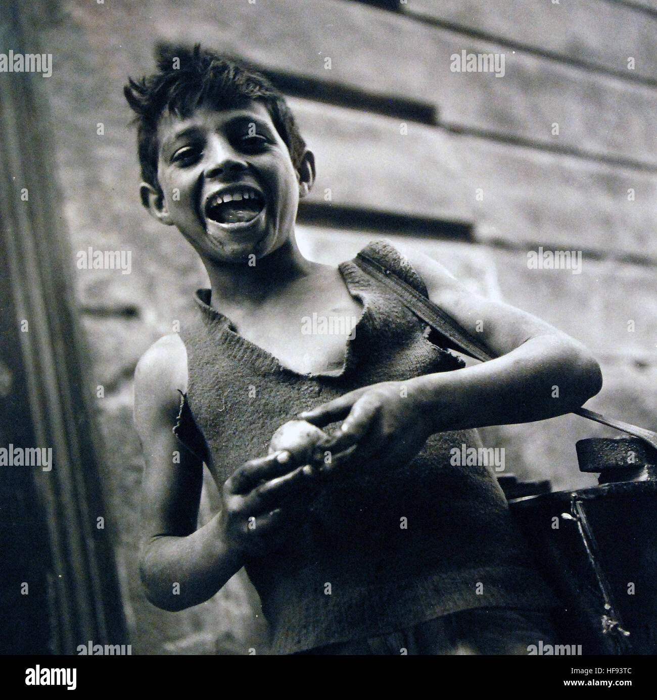 Boy enjoying fruit. Naples, August 1944 Stock Photo - Alamy