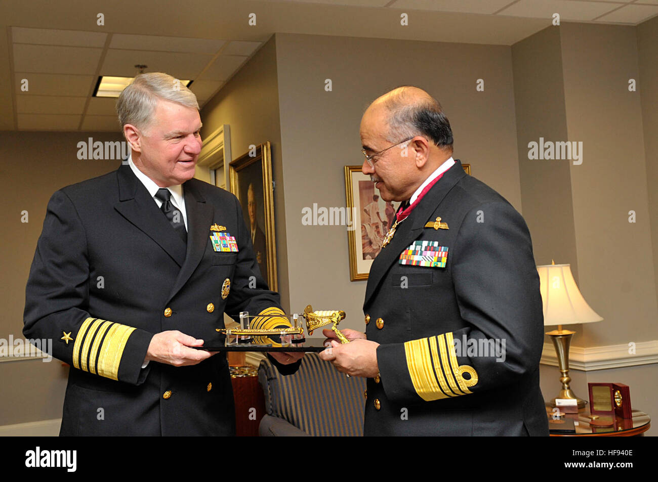 Chief of Naval Operations Adm. Gary Roughead exchanges gifts with ...
