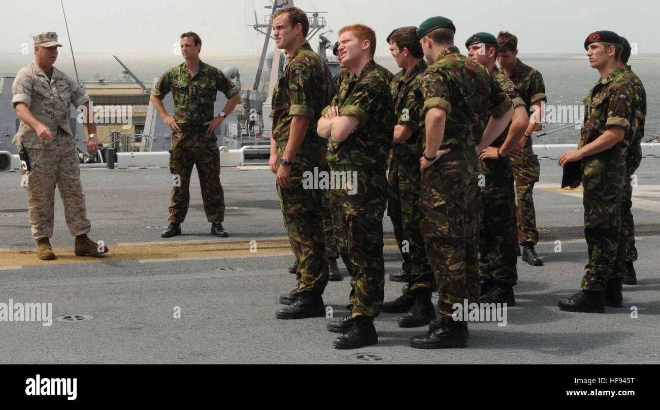 A group of British Royal Marines listen to Chief Warrant Officer Bryan ...