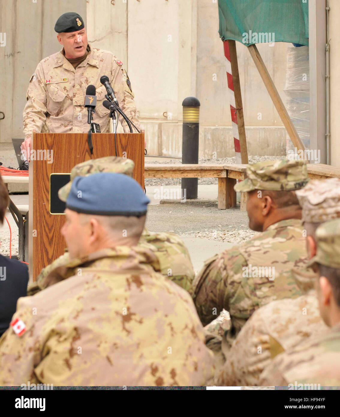 Canadian Army Maj. Gen. Dean Milner, at lectern, the outgoing commander ...
