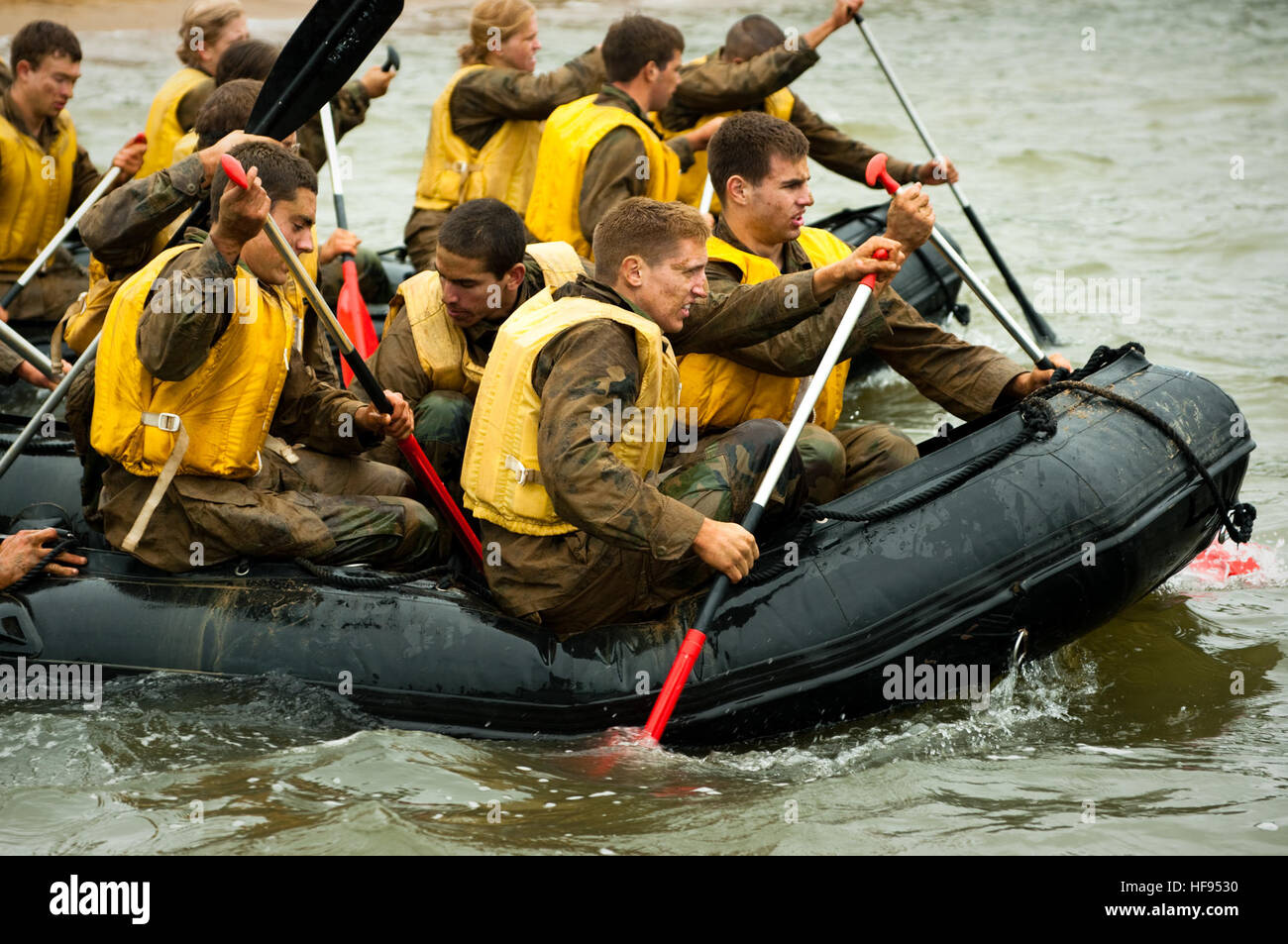 U.S. Naval Academy plebes paddle pontoon boats during a team-building ...