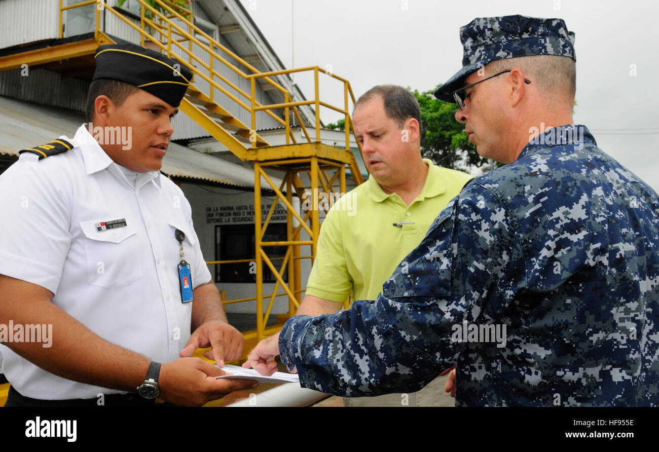 U.S. Navy Chief Lewis Biddlecome speaks with a Panamanian officer about ...