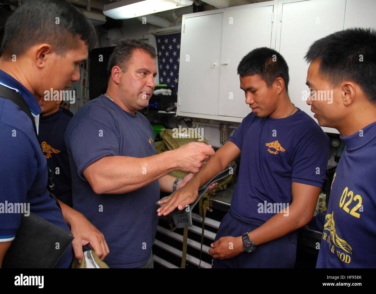 U.S. Navy Senior Chief Hospital Corpsman Daniel Ritch demonstrates the ...