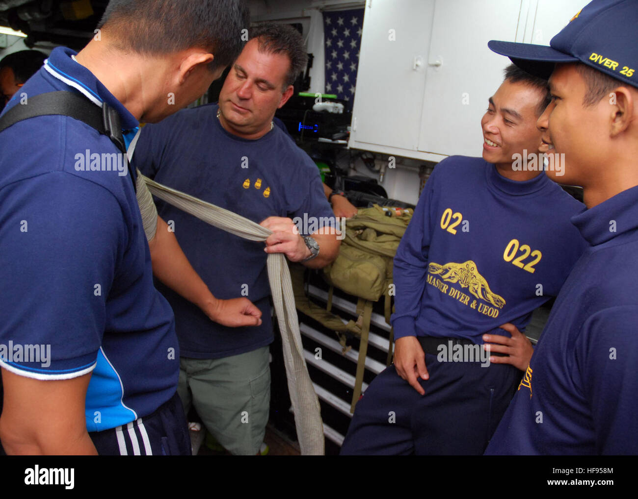 U.S. Navy Senior Chief Hospital Corpsman Daniel Ritch demonstrates the ...