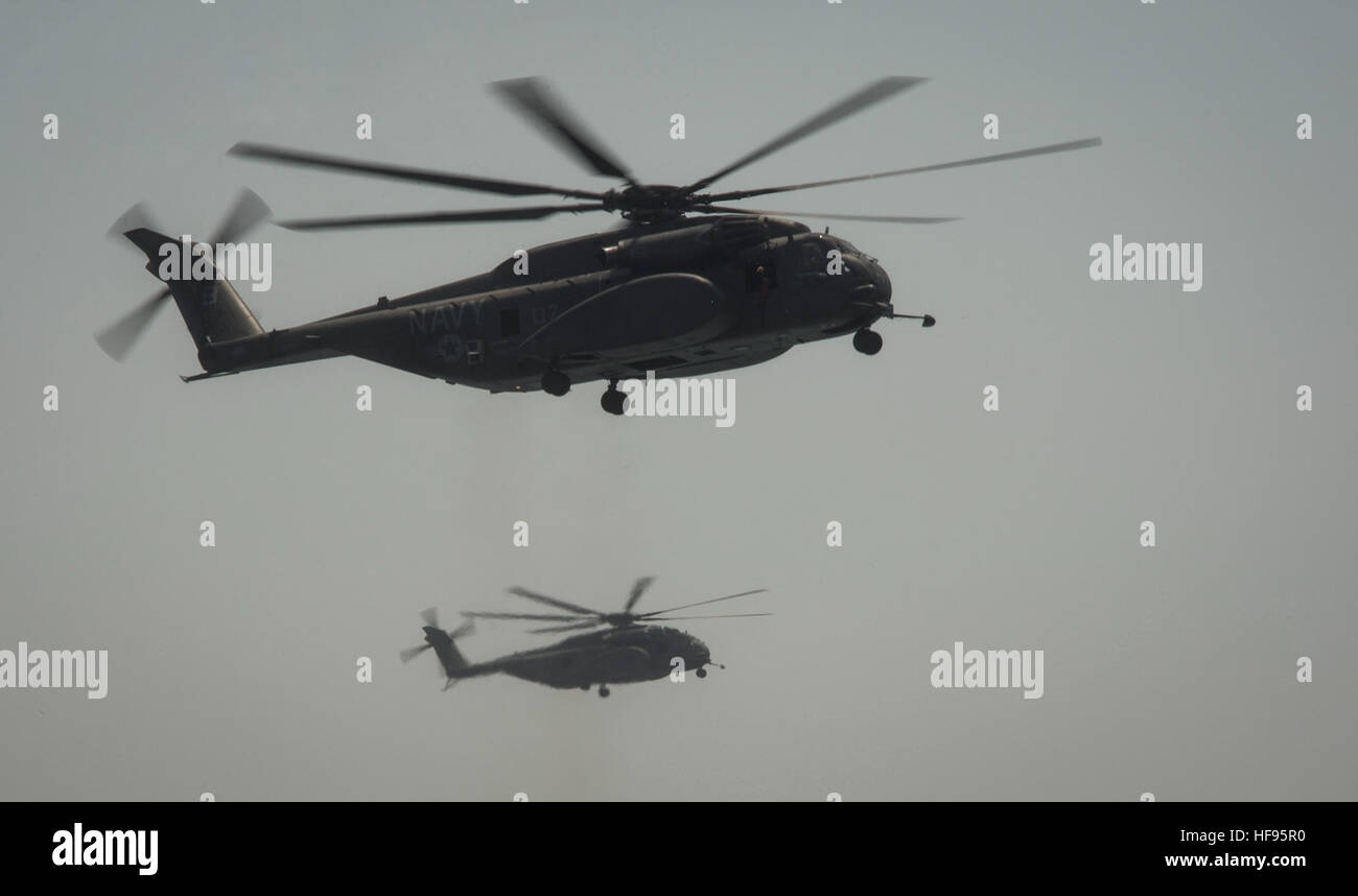 Two U.S. Navy MH-53E Sea Dragon helicopters assigned to Helicopter Mine ...
