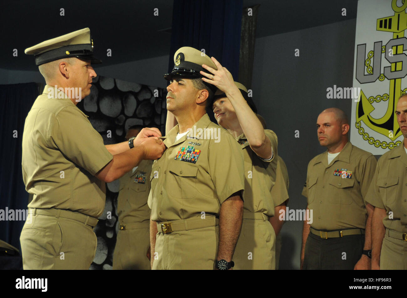 U.S. Navy Chief Petty Officer Joseph Vitale receives his anchor pins ...