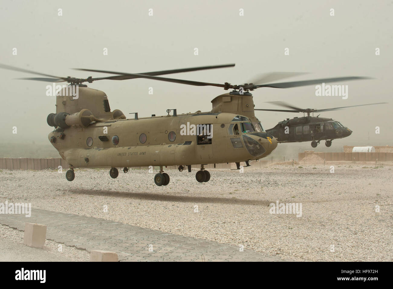 A CH-47F Chinook from1st Air Cavalry Brigade, foreground and a UH-60 ...